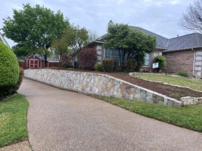 Replaced cross tie wall with Milsap stone wall in Bedford, Texas