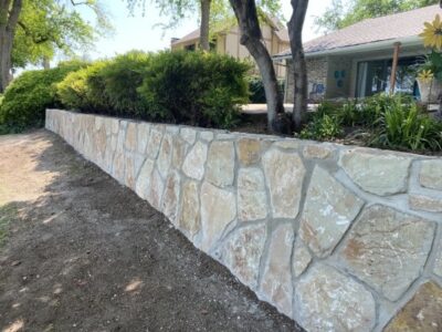 Replaced old crosstie wall with Millsap stone wall in Richardson, TX